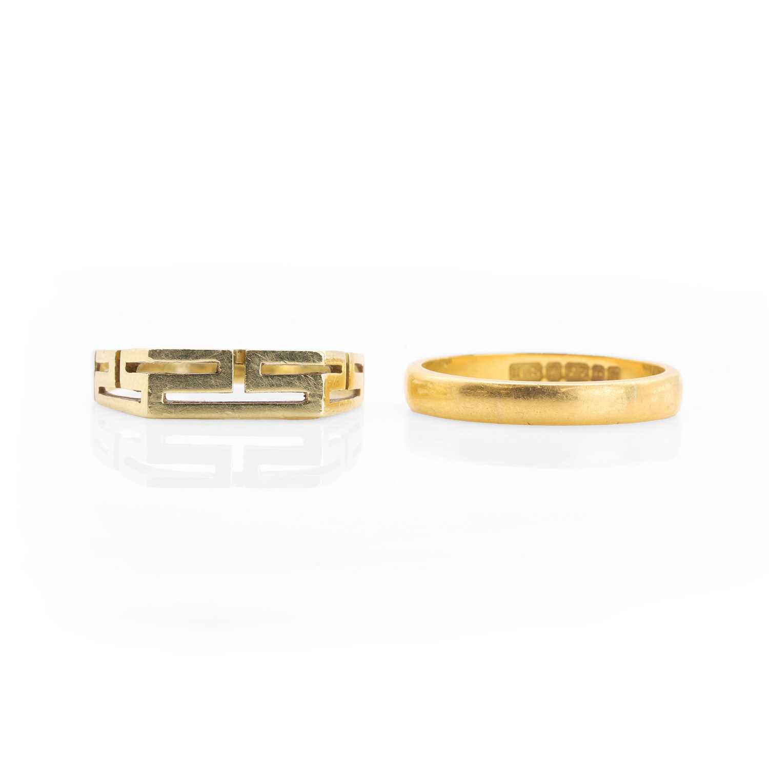 A 22ct gold wedding ring and a Greek key design ring | Barnebys