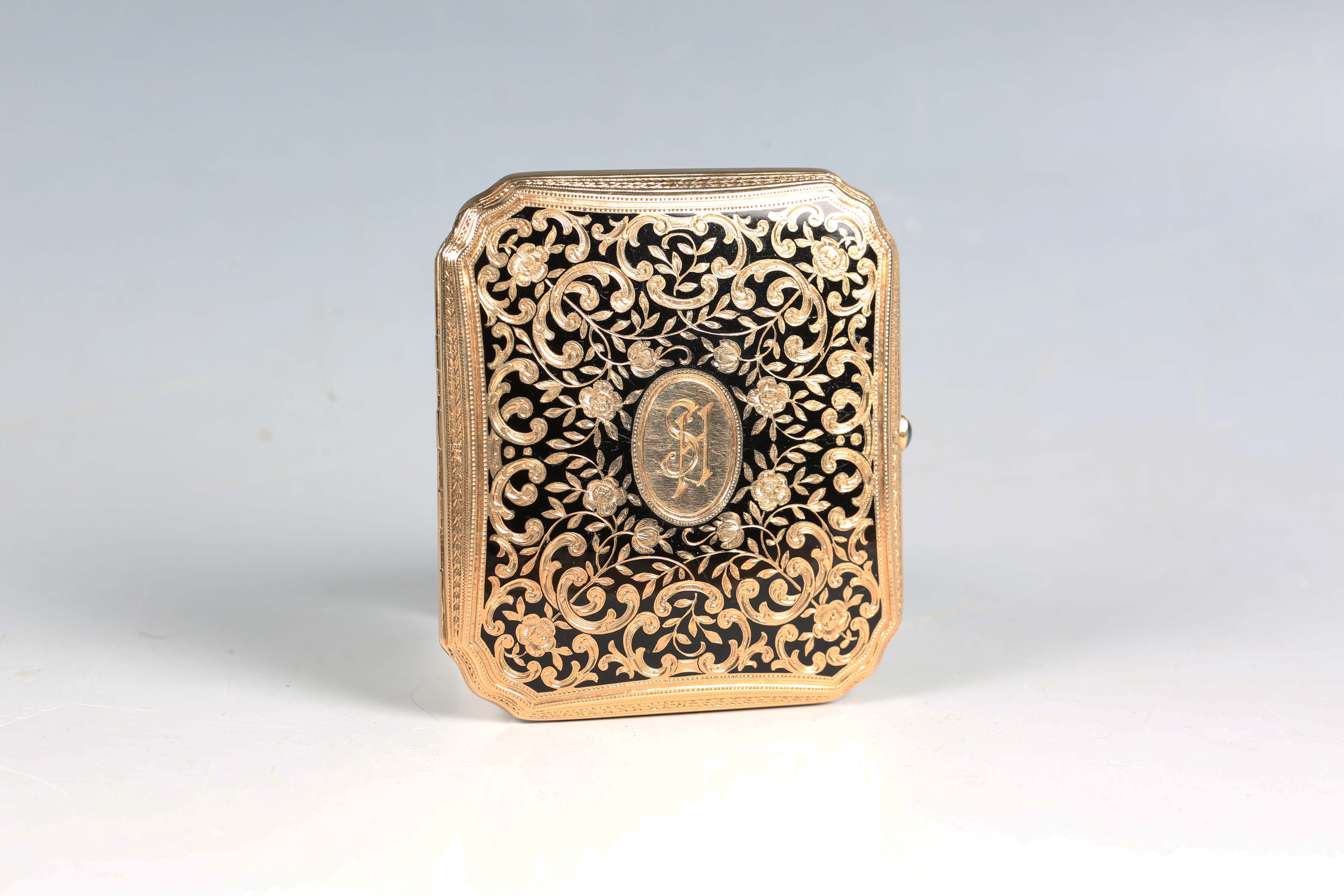 A 14ct gold and black enamel shaped rectangular cigarette case, the ...