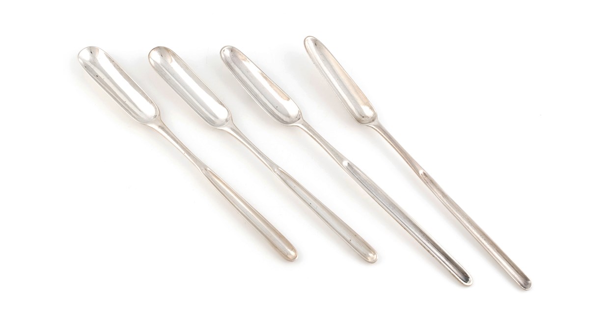A collection of four George II/III silver marrow scoops | Barnebys