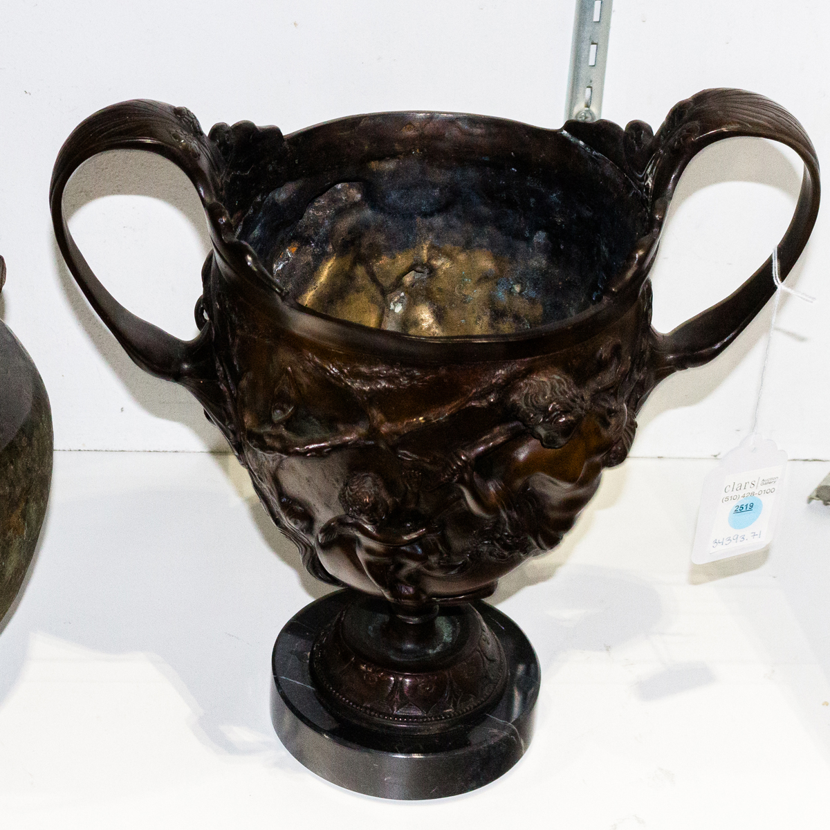 A Grand Tour style patinated bronze urn on marble plinth | Barnebys