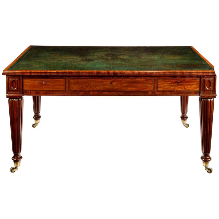 A Regency well-figured mahogany writing table | Barnebys