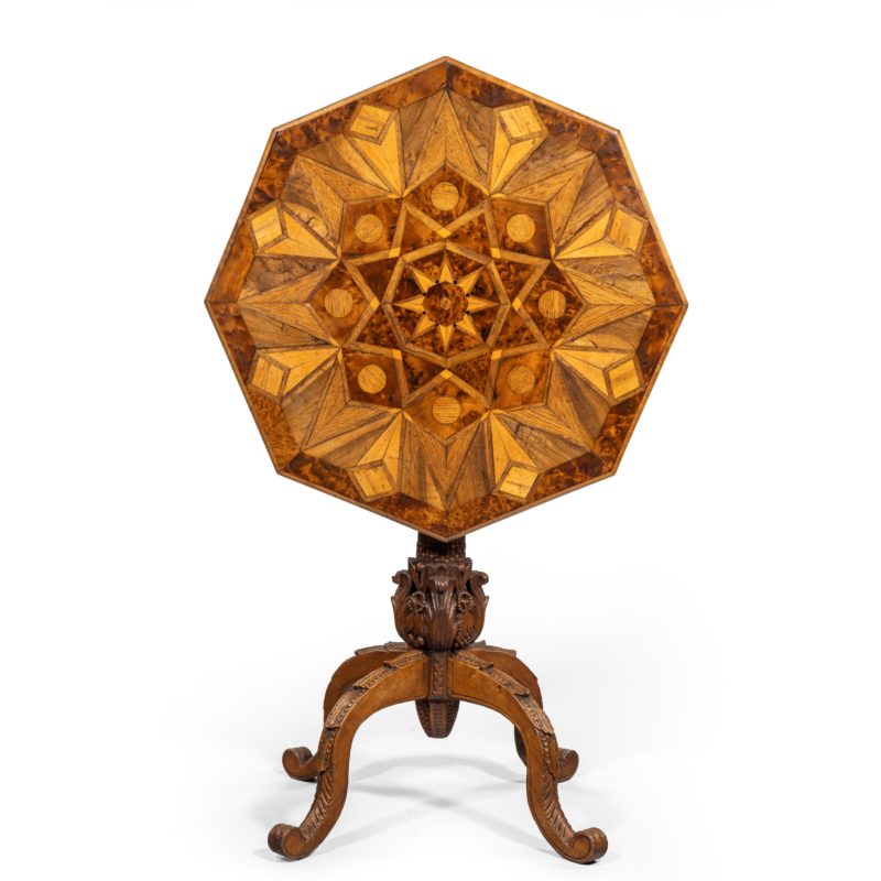 An octagonal indigenous specimen wood marquetry table | Barnebys