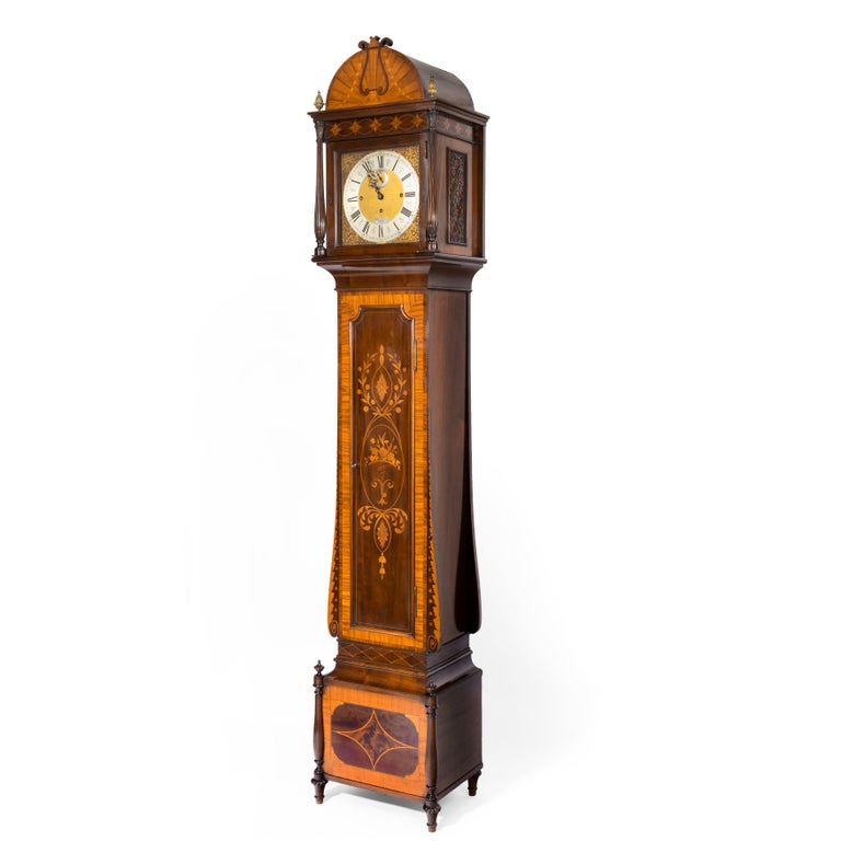 An unusual flame mahogany long-case clock attributed to Maples | Barnebys