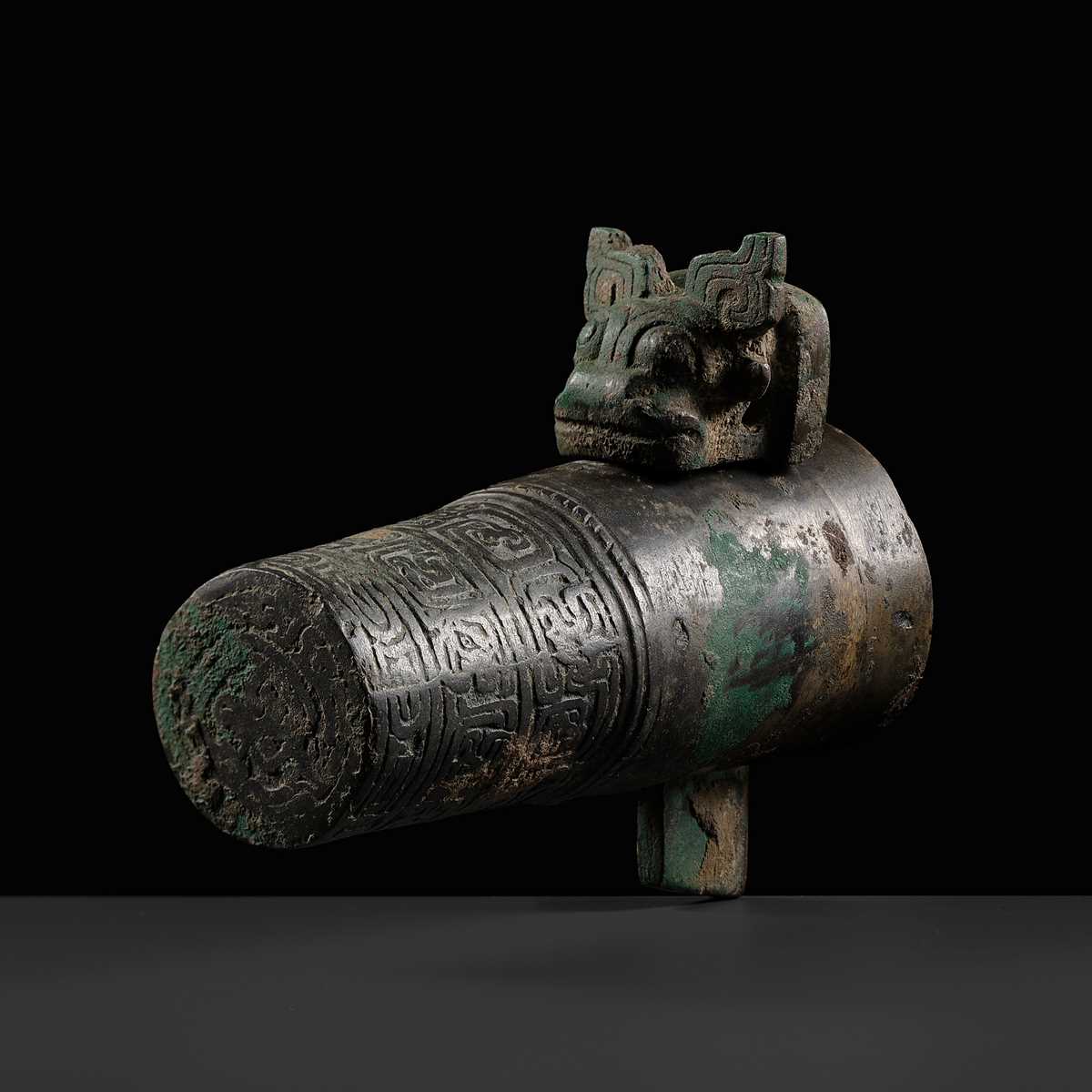 A BRONZE CHARIOT AXLE CAP AND LINCHPIN, WESTERN ZHOU DYNASTY | Barnebys