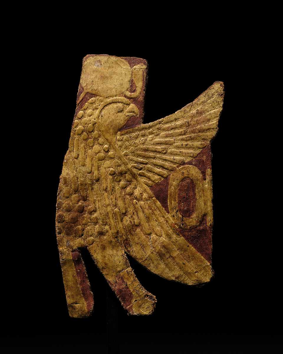 A GILT MUMMY CASING FRAGMENT DEPICTING A FALCON, LATE PERIOD-PTOLEMAIC ...