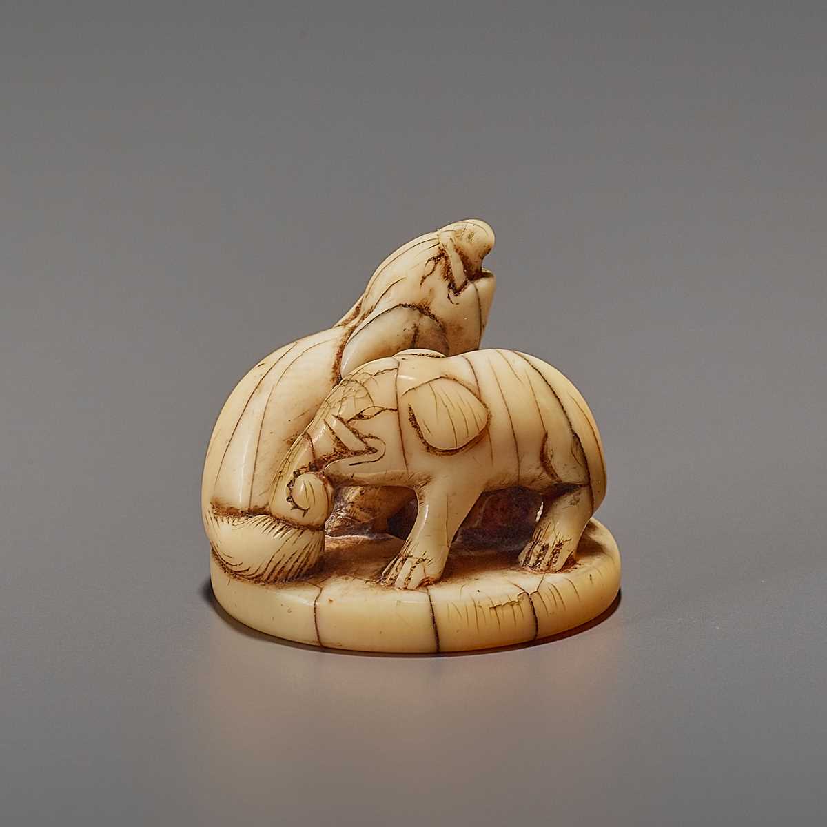 Ɏ A RARE AND EARLY IVORY NETSUKE OF AN ELEPHANT AND BAKU | Barnebys