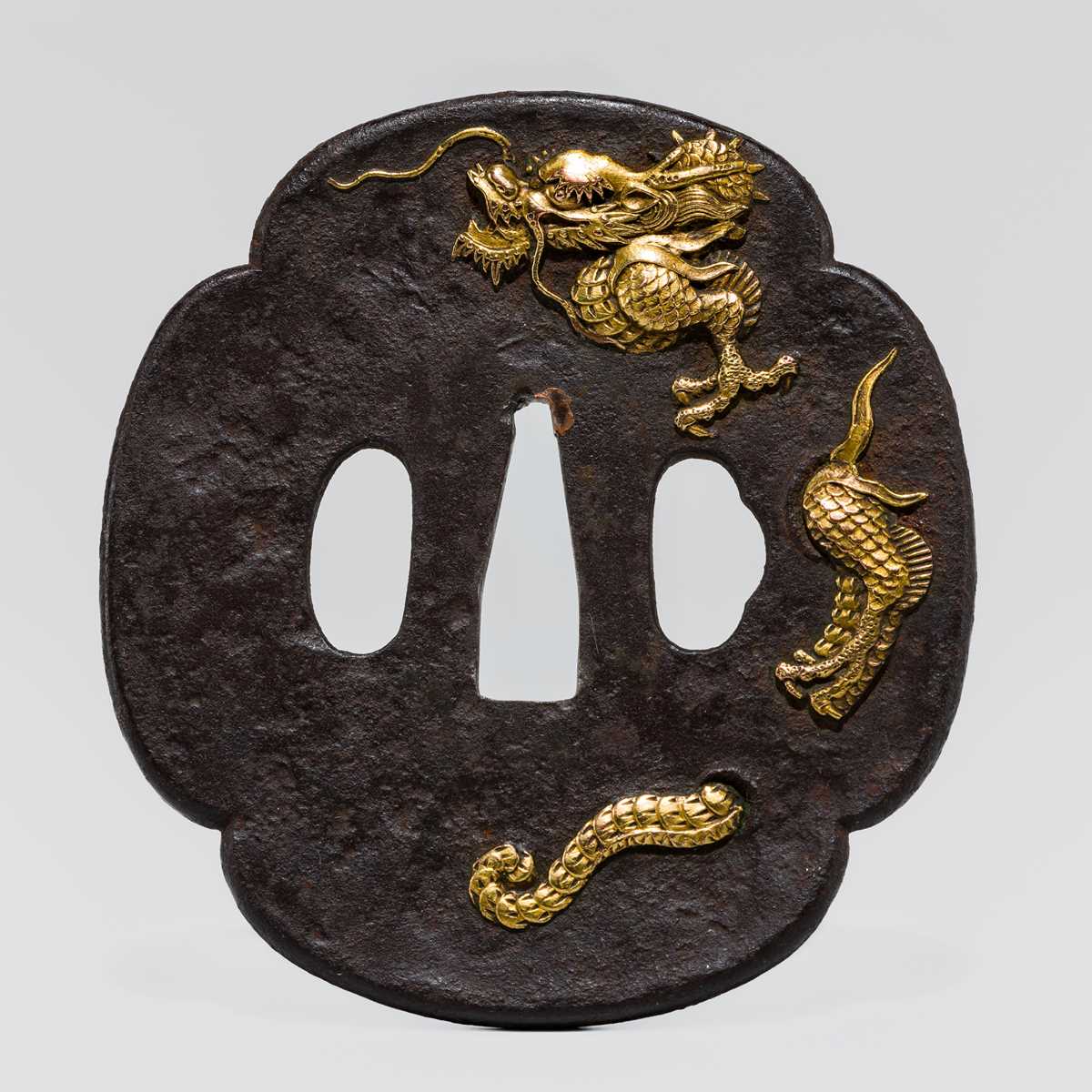 A JAKUSHI SCHOOL IRON ‘DRAGON’ TSUBA | Barnebys