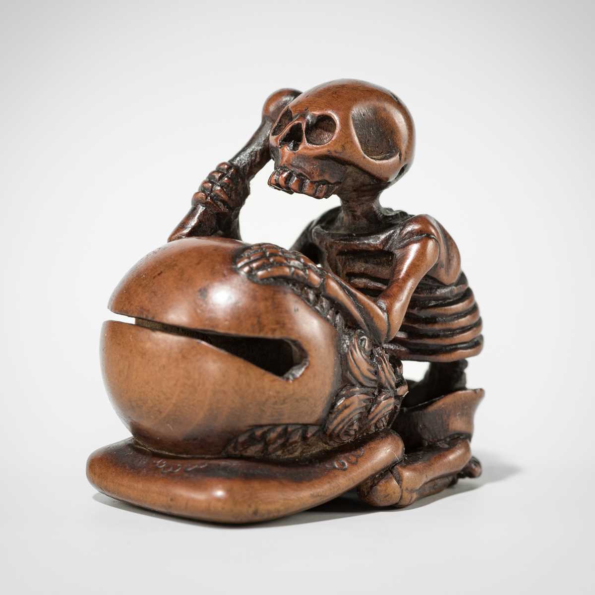 TOMOMASA: A WOOD NETSUKE OF A SKELETON DRUMMING ON A MOKUGYO | Barnebys