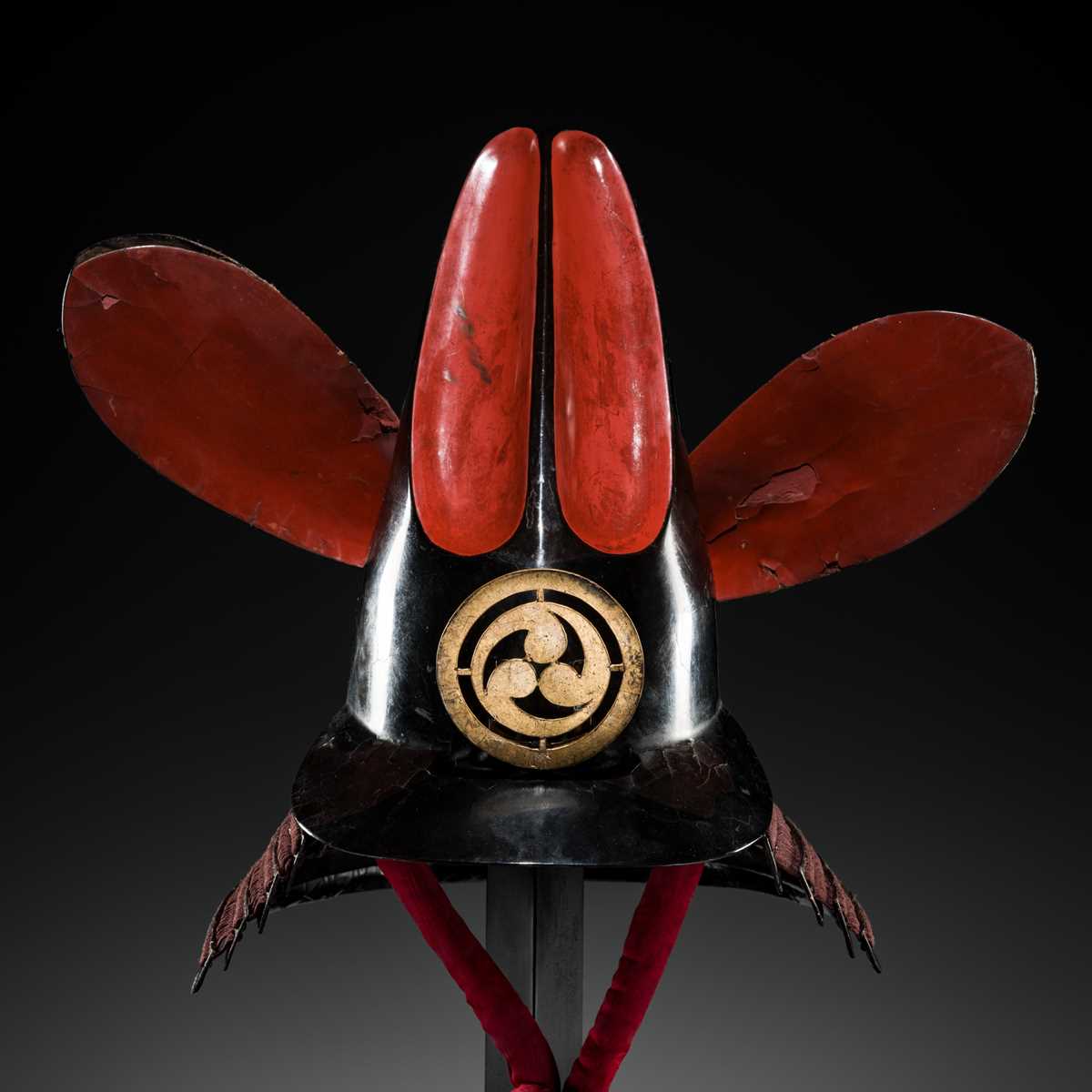 A RARE LACQUERED IRON ‘RABBIT EARS’ KAWARI KABUTO (ECCENTRICALLY SHAPED ...