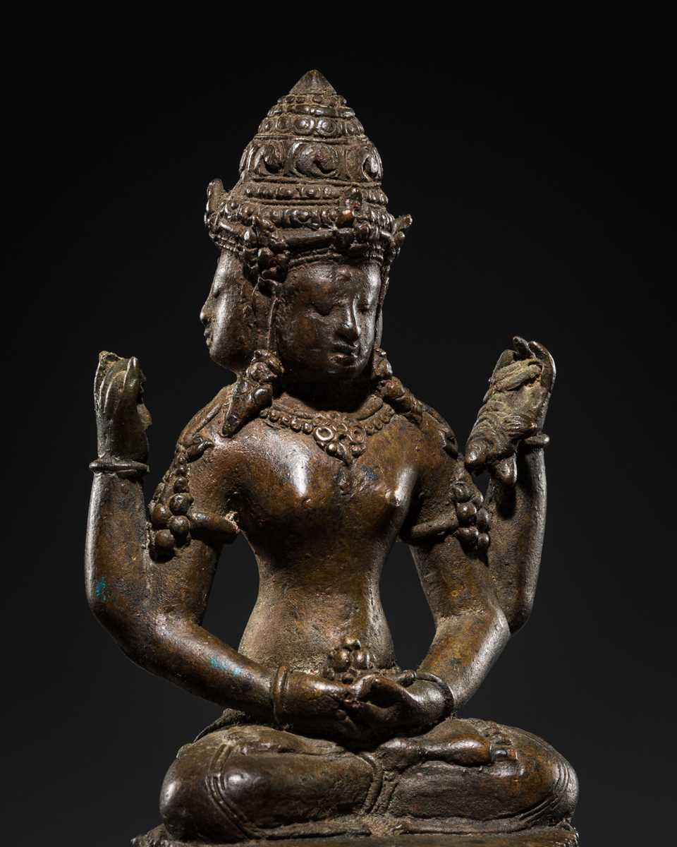 A BRONZE FIGURE OF AN ESOTERIC FEMALE DEITY, CENTRAL JAVA, 9TH-10TH ...