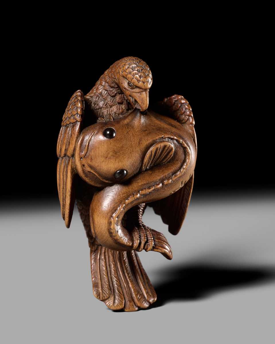 IKKAN: A SUPERB WOOD NETSUKE OF AN EAGLE AND NAMAZU | Barnebys