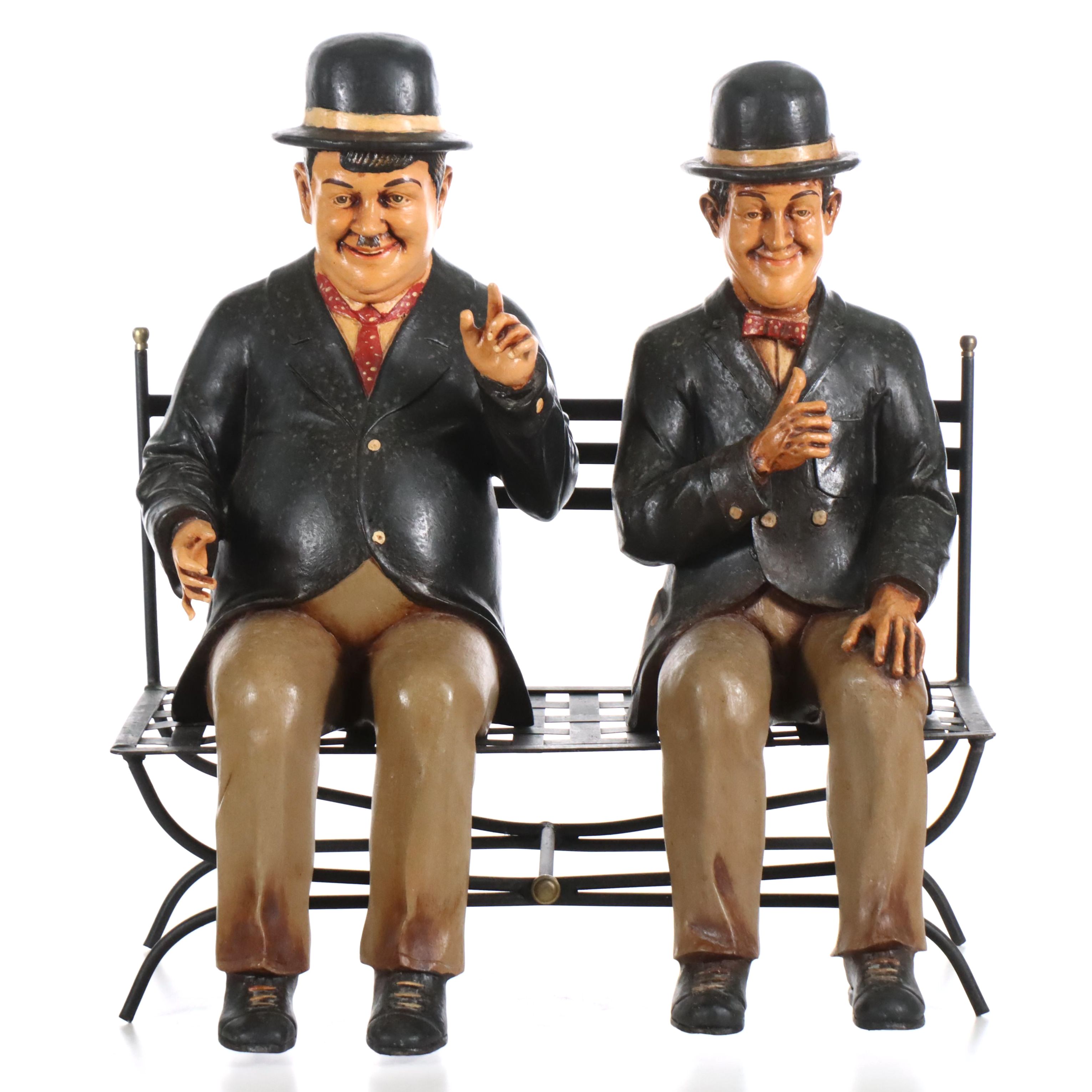 Resin Laurel and Hardy Statues Sitting on Metal Bench | Barnebys