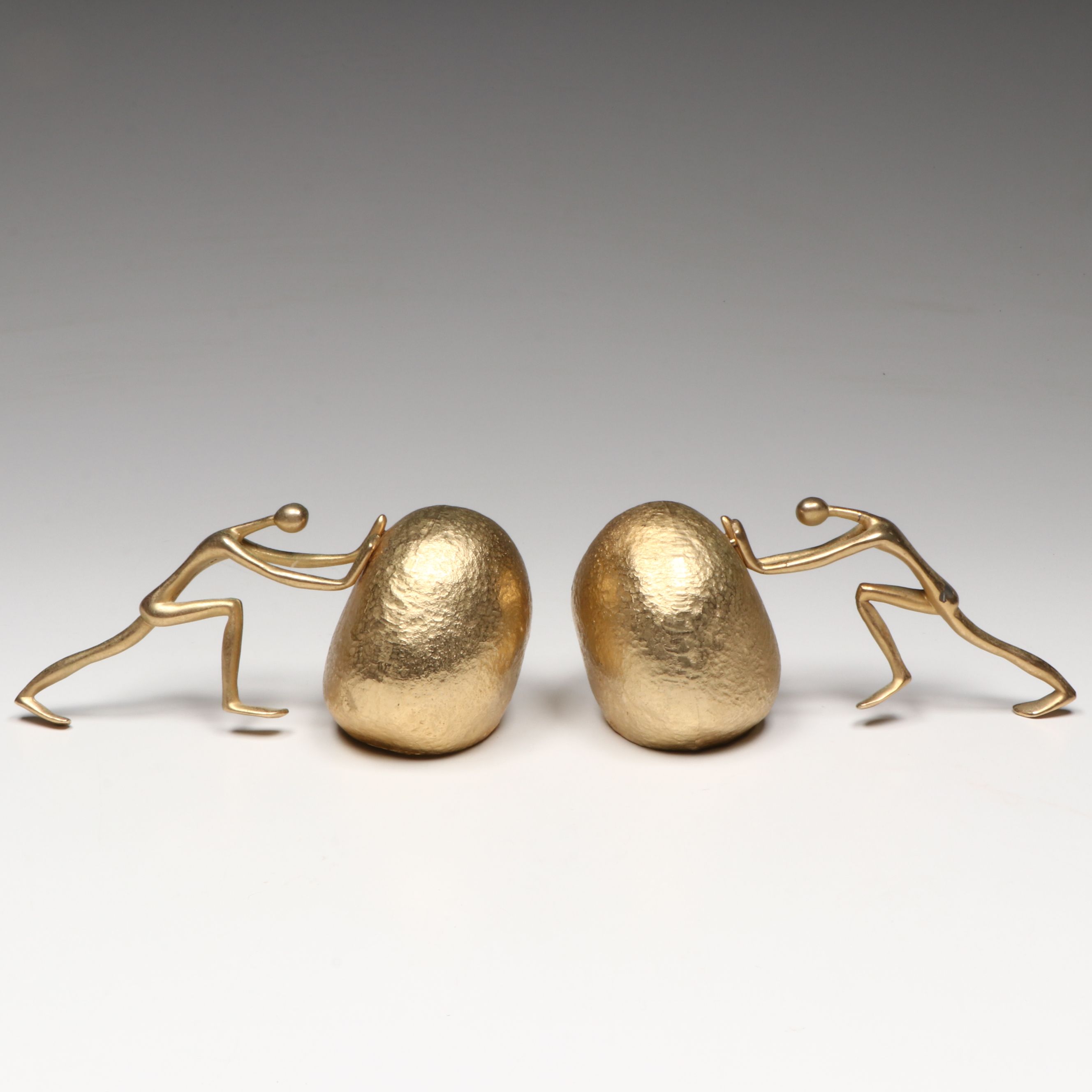 Pair of Ted Arnold Gilt Finish Sisyphus and Rock Bookends | Barnebys