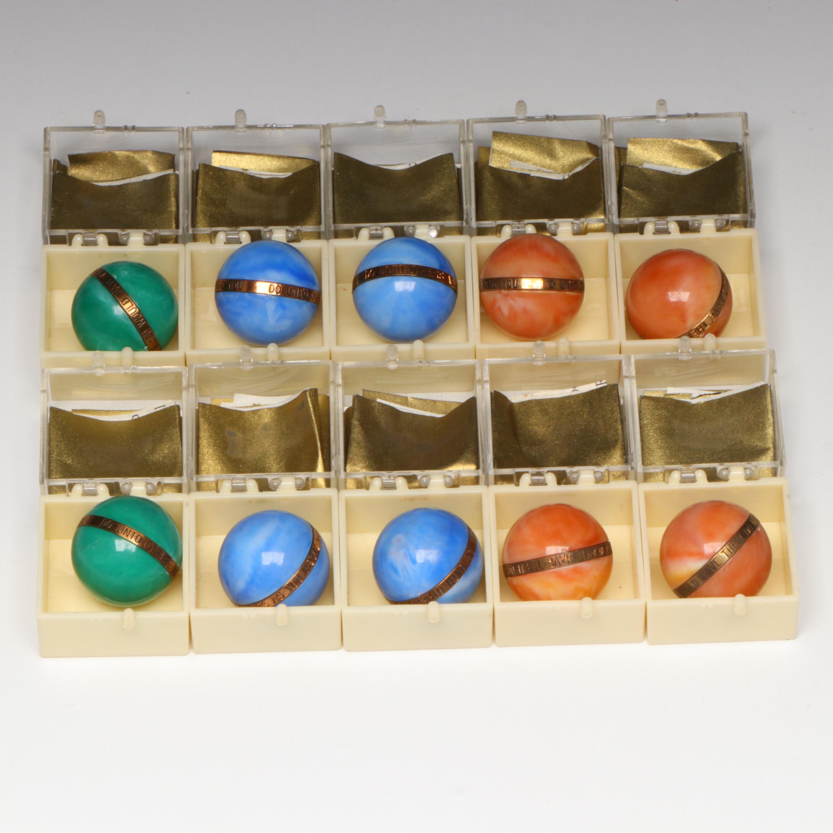 The Golden Rule Acrylic Marbles with Brass Bands, 1960s | Barnebys