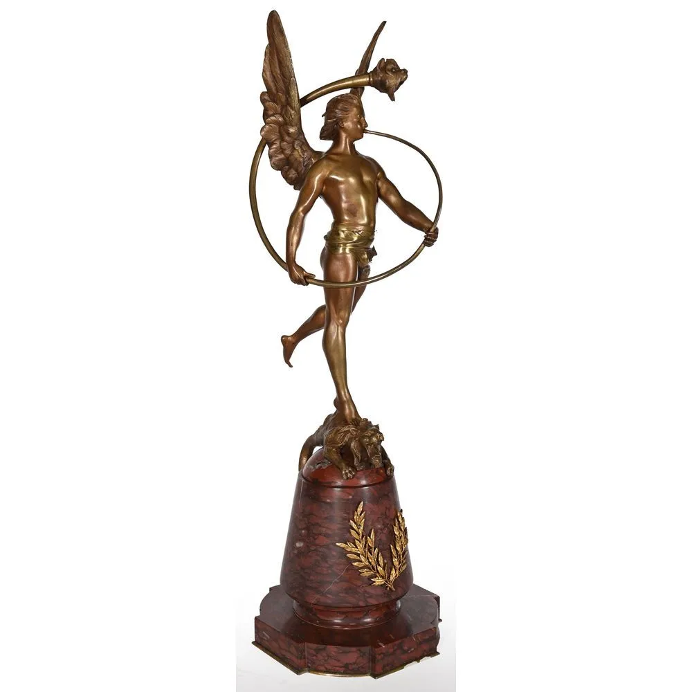 A bronze SPECTACULAR with a golden patina representing a winged figure ...