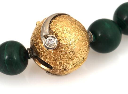 Ole Lynggaard: A "Smile" clasp set with diamonds, mounted in 14k gold ...