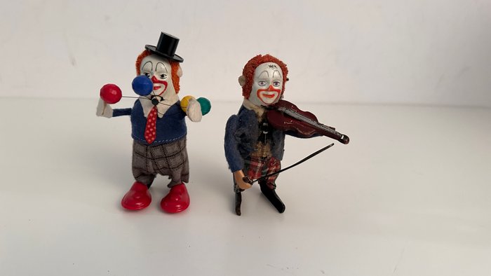 Schuco - 2x Felt Clockwork Clown Figures - Wind-up tin figure | Barnebys