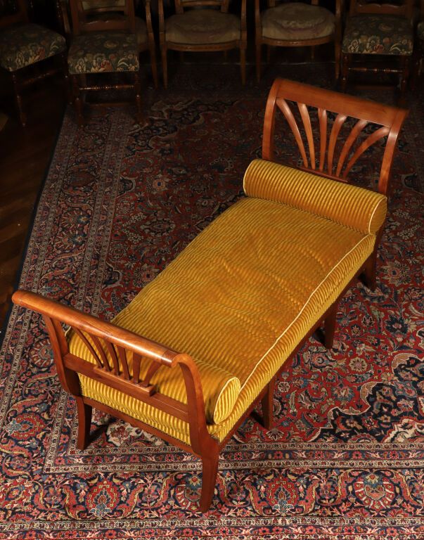 608 - Cherry wood reclining bench, the uprights in the shape of ...