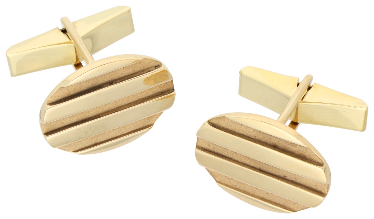 #308 | Tiffany & Co 18K Atlas groove oval yellow gold cufflinks | Barnebys