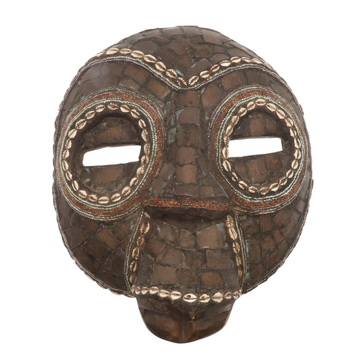 A FINE SOUTH AFRICAN COPPER, COWRIE SHELL AND BEADWORK MASK.... | Barnebys