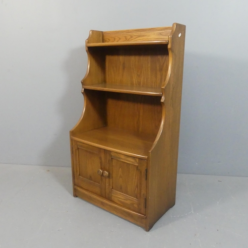 ERCOL - A waterfall open bookcase, with cupboards to base an... | Barnebys