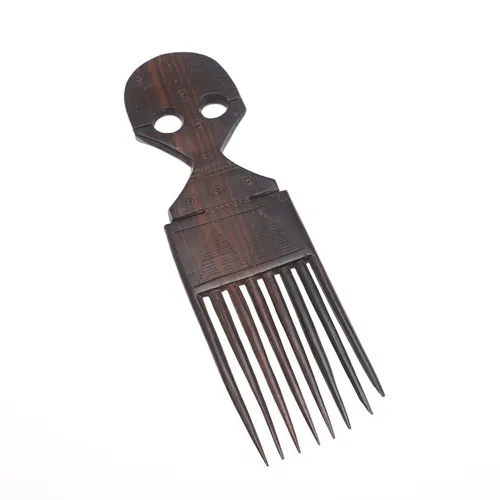 A MID 20TH CENTURY AFRICAN HAIR COMB. A hardwood comb with e... | Barnebys