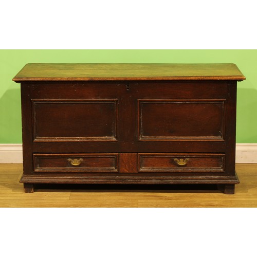 An 18th century oak mule chest, hinged cover above a two pan... | Barnebys