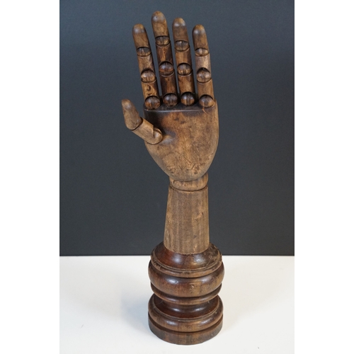 Articulated poseable wooden artists model of a hand stood on... | Barnebys
