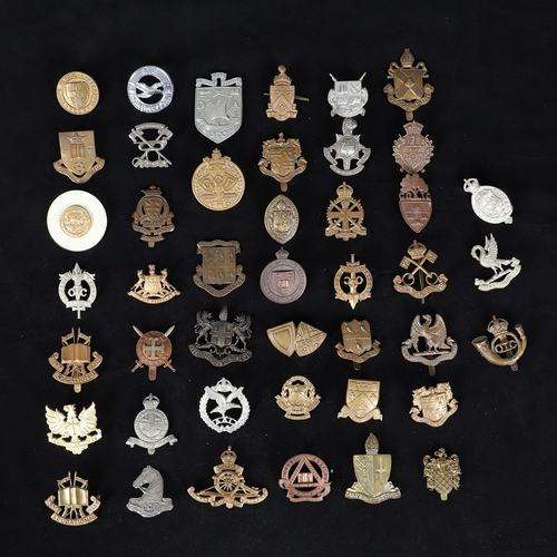 A COLLECTION OF MILITARY CAP BADGES FOR OFFICER TRAINING COR... | Barnebys