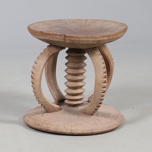 AN AFRICAN TRIBAL STOOL, POSSIBLY NIGERIAN. The circular sli... | Barnebys