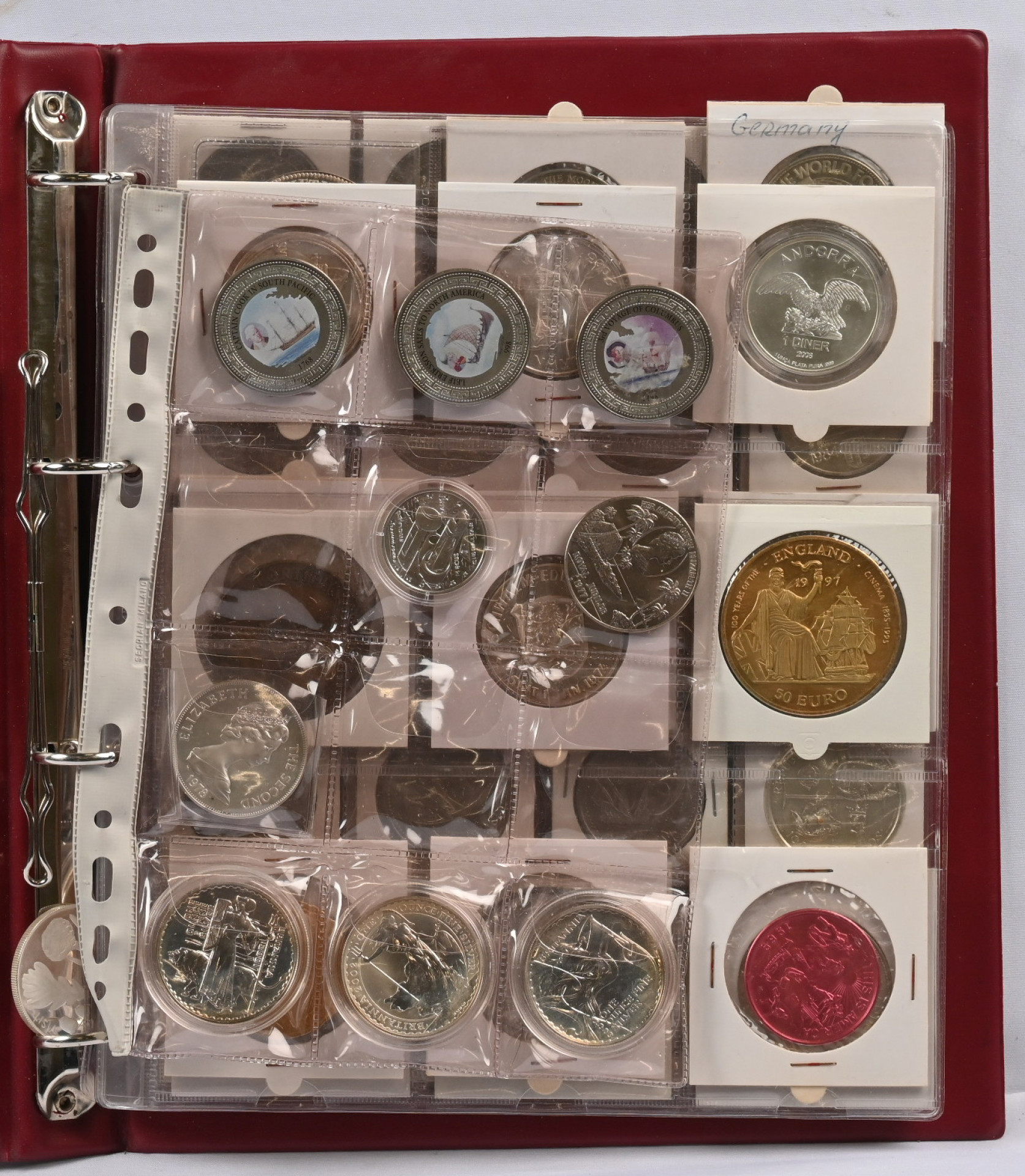 Commemorative coins almost 50 pieces in album. Many related to ...