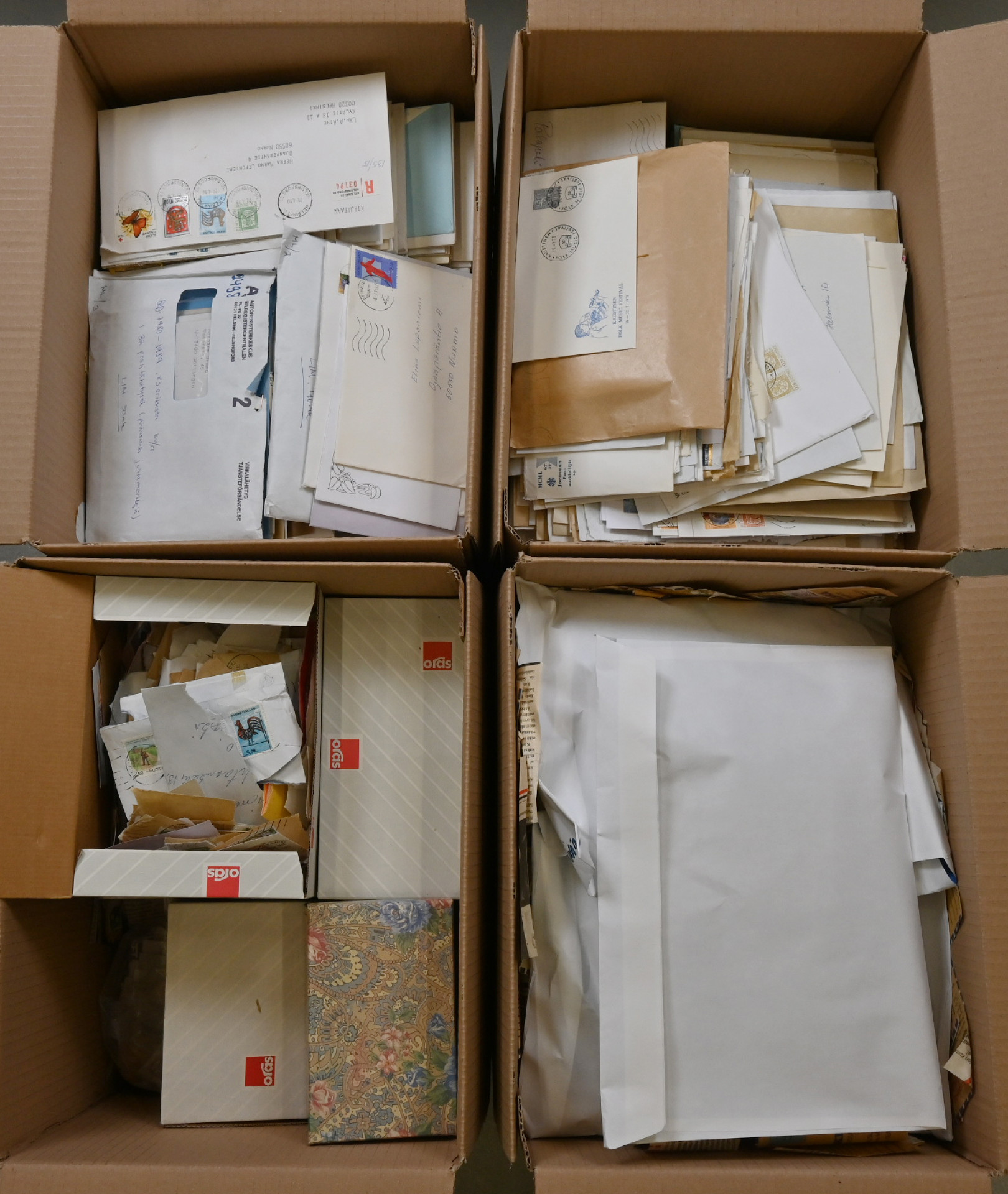 Postal items and kiloware large selection in four boxes, total of ...