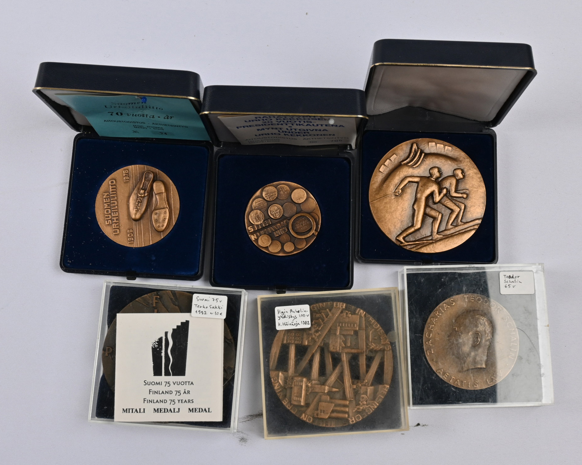 Table medals 12 different, eg. Finland 75 years (Terho Sakki 1992 ...
