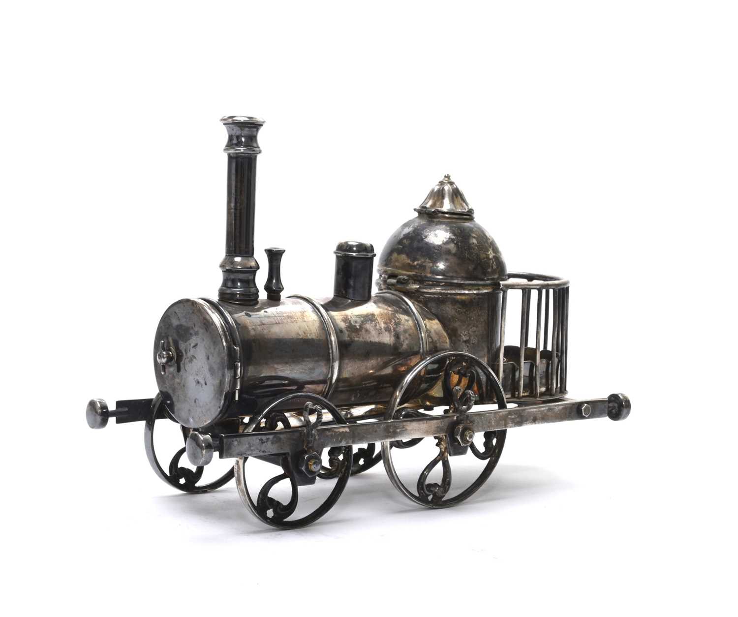 An unusual silver plated ink stand in the form of a steam engine | Barnebys