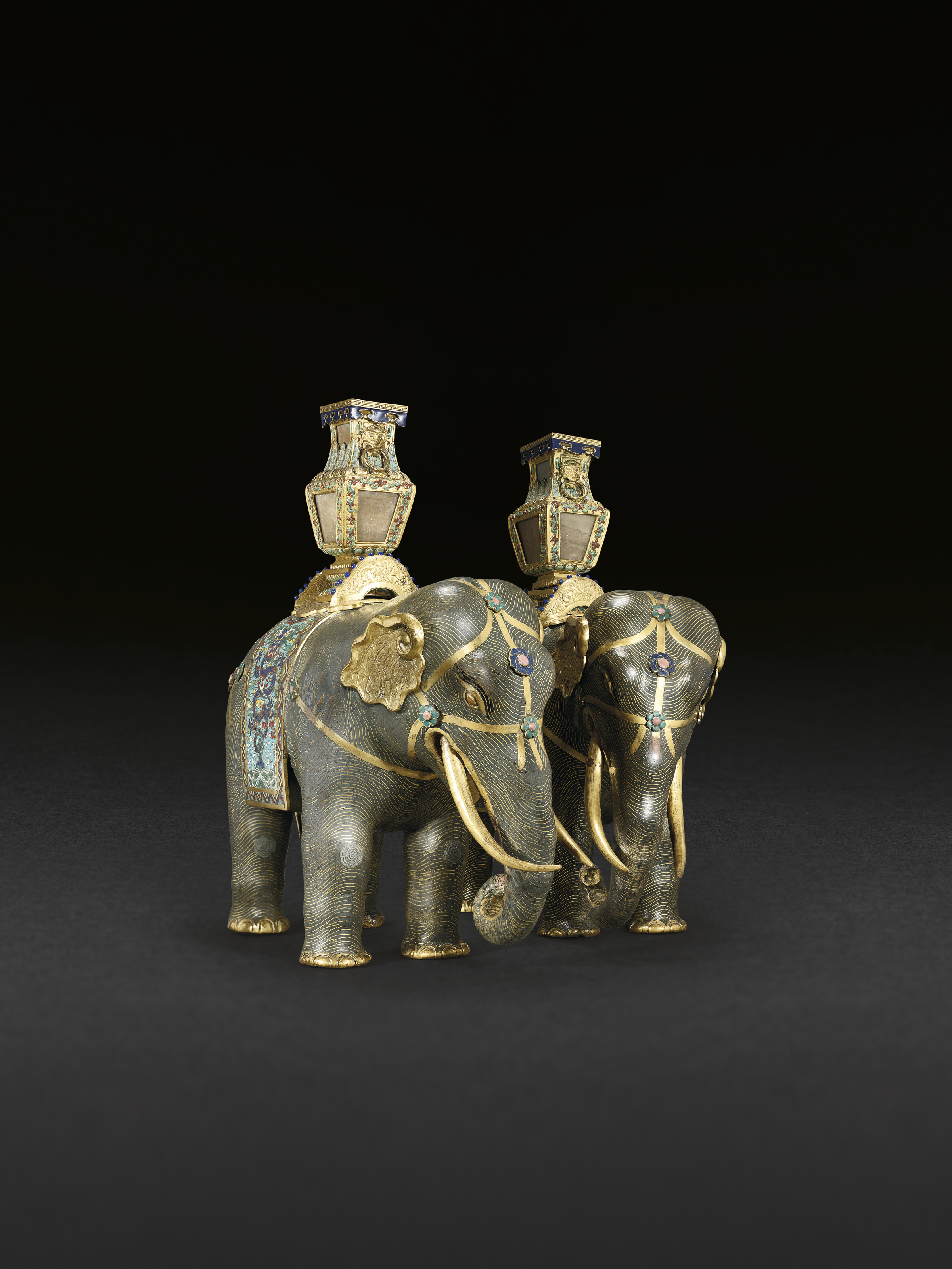 A MAGNIFICENT PAIR OF CLOISONNÉ ENAMEL FIGURES OF CAPARISONED ELEPHANTS ...