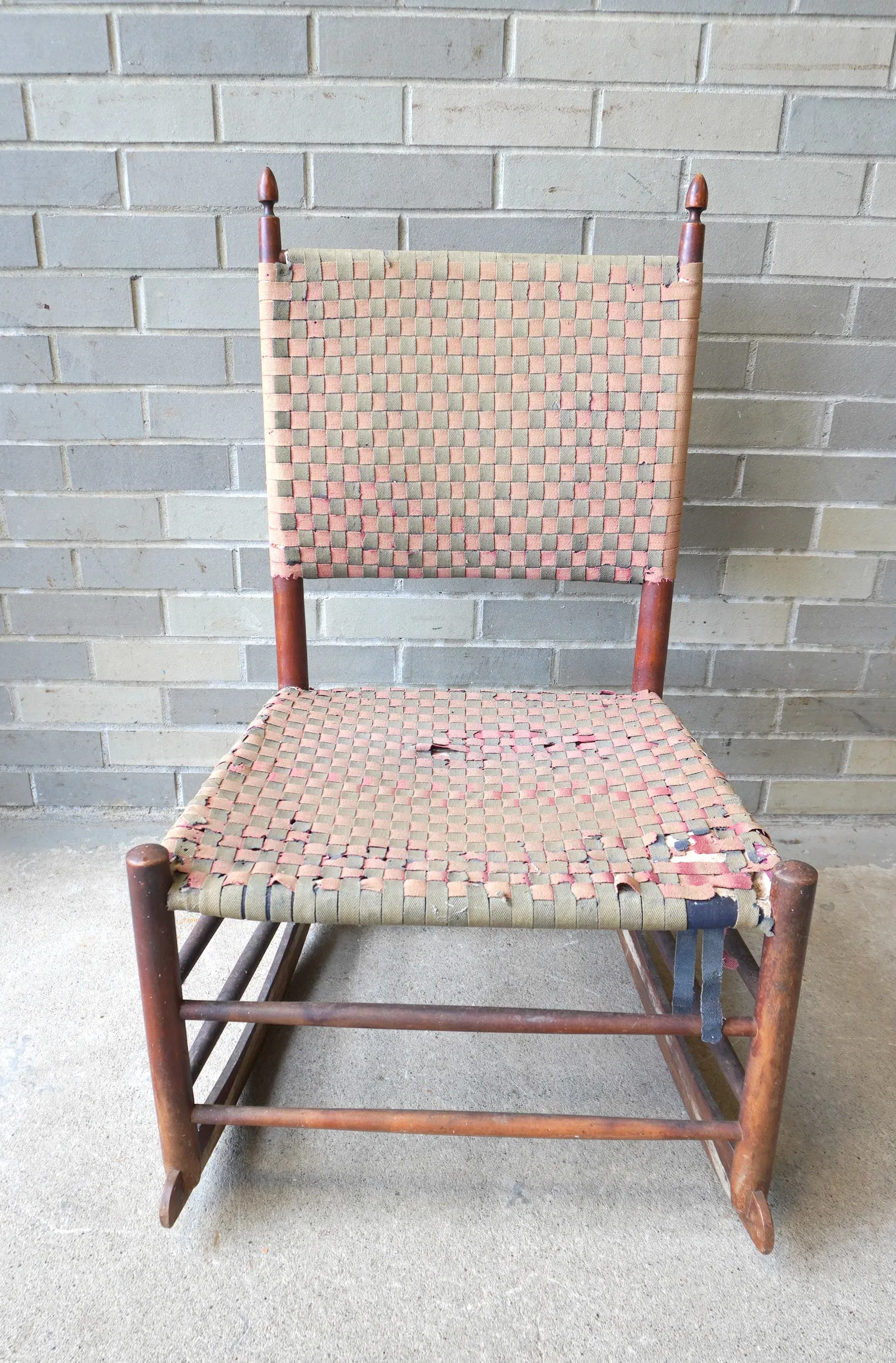 A Shaker rocker with the original woven taped seat and back and in ...